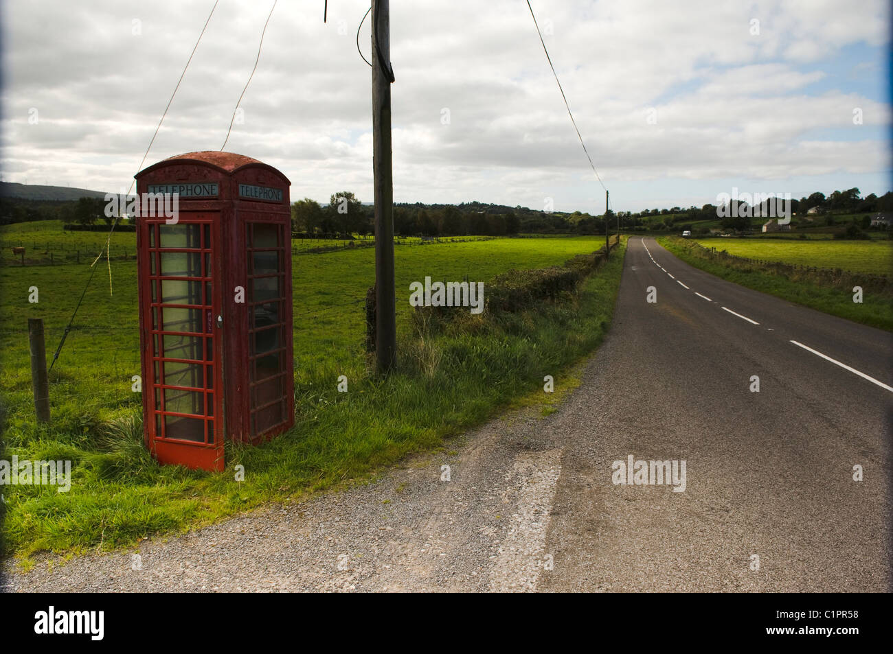 Red telephone box at side of road to belleek hi-res stock photography ...