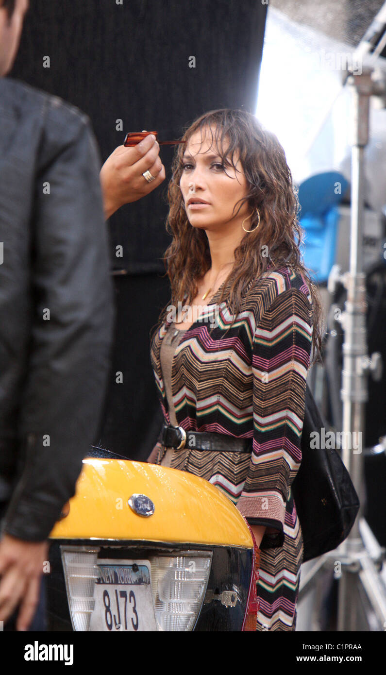 Jennifer Lopez filming a scene in the rain for her new film 'The Back ...