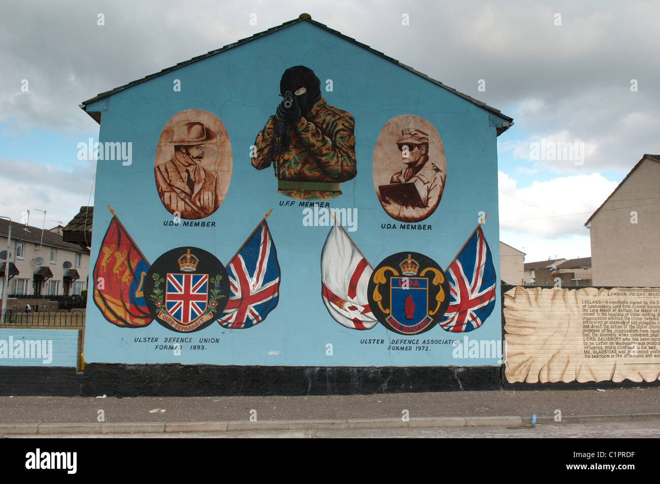 House with ulster defence association mural on wall hi-res stock ...
