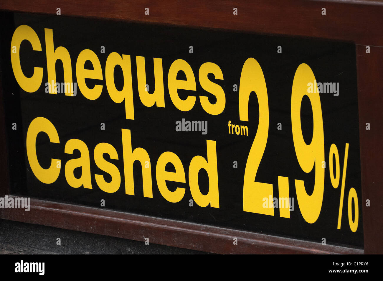 cheques cashed shop sign Stock Photo - Alamy