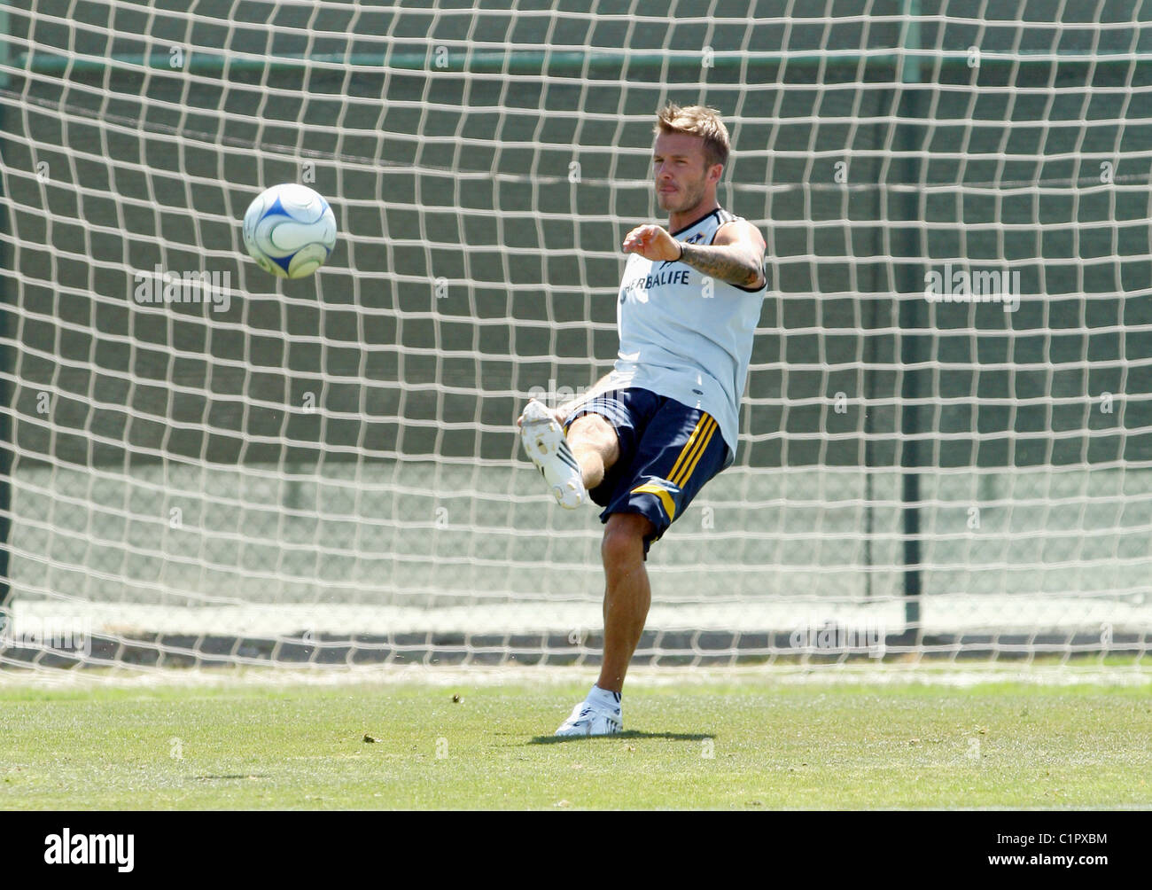 David Beckham kicks the ball during his first training session for the ...