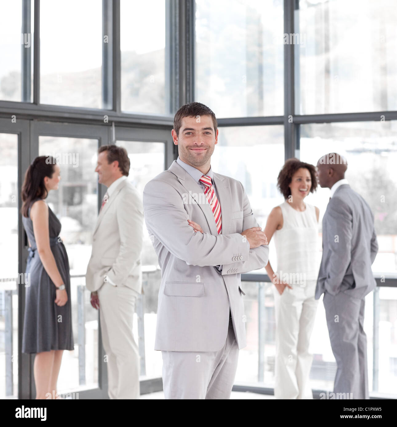 Portrait of a male manager leading his team Stock Photo - Alamy