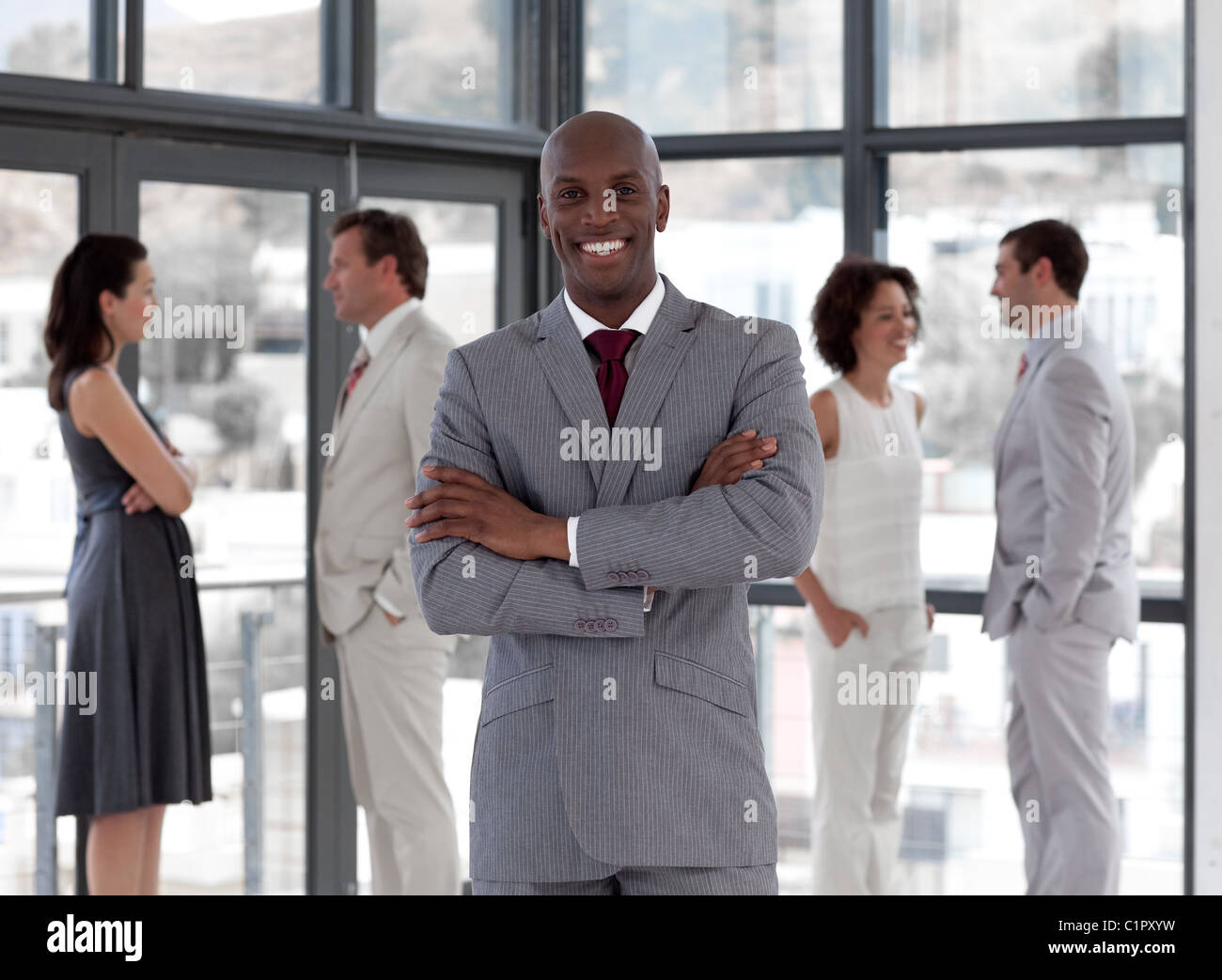 Portrait of a male manager leading his team Stock Photo - Alamy
