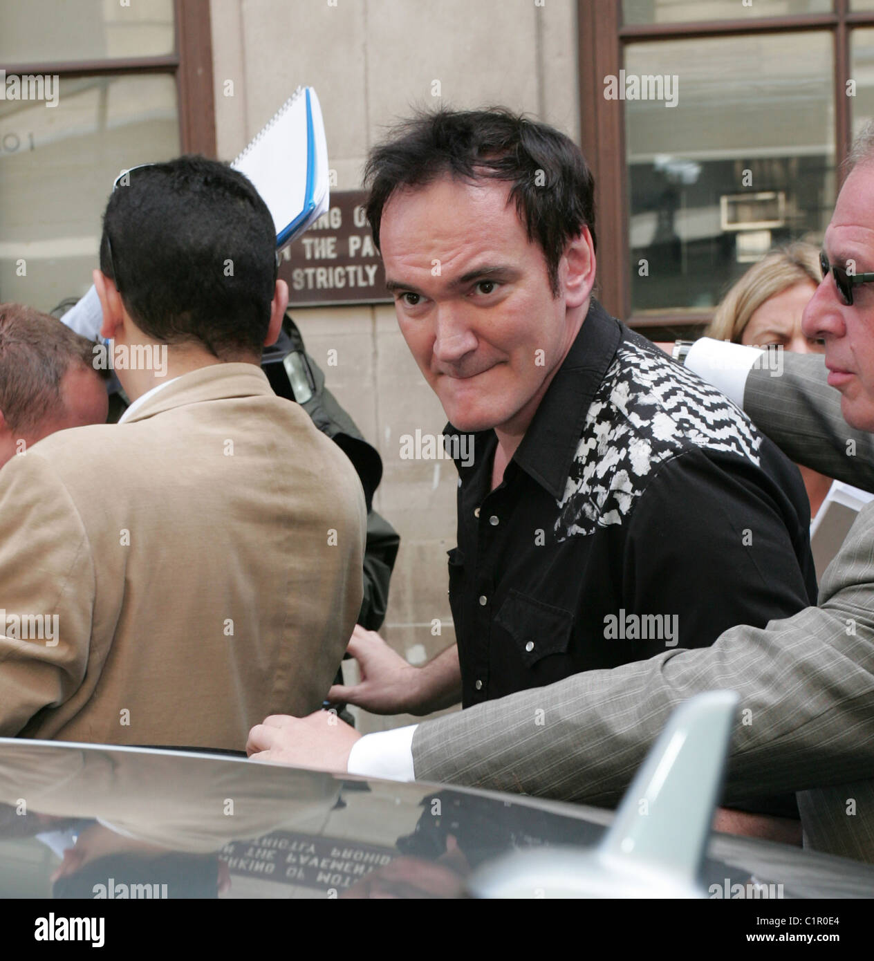Quentin Tarantino signs autographs after leaving the Radio One studios ...