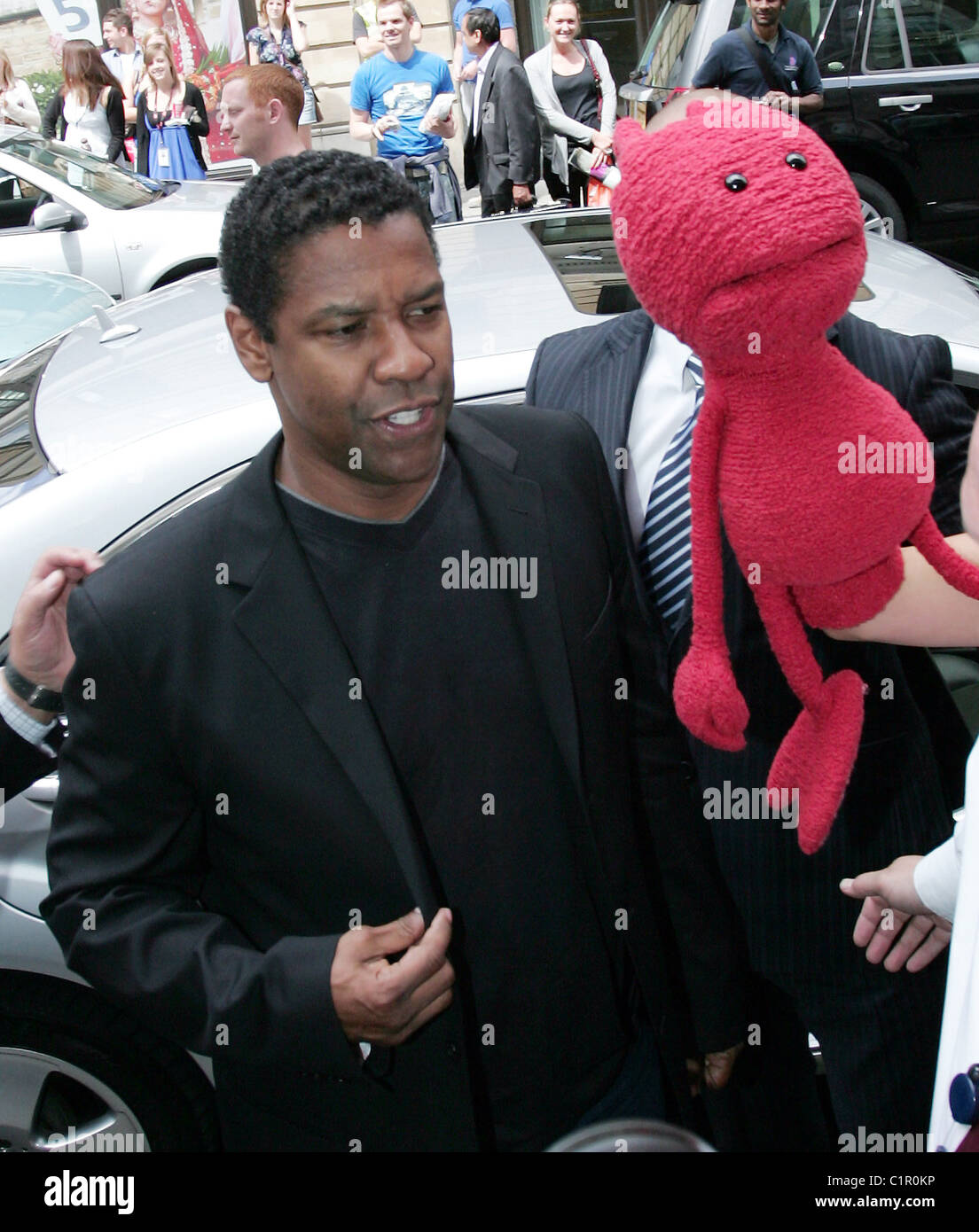 Denzel Washington is ambushed by the Virgin One Mascot "Red" as he ...