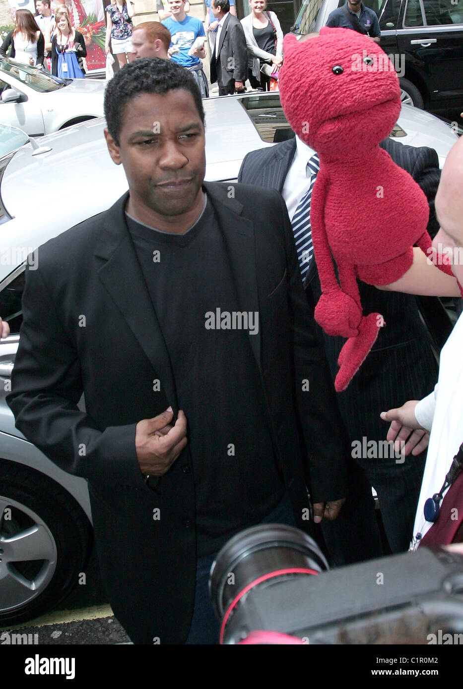 Denzel Washington is ambushed by the Virgin One Mascot "Red" as he ...
