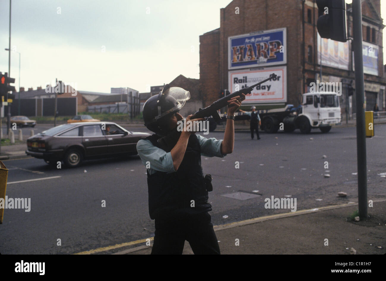 RUC Royal Ulster Constabulary policeman officer takes aim shoots at a ...