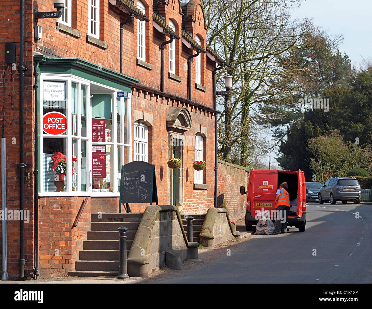 Royal Mail collection of post from a small village Post Office Stock ...