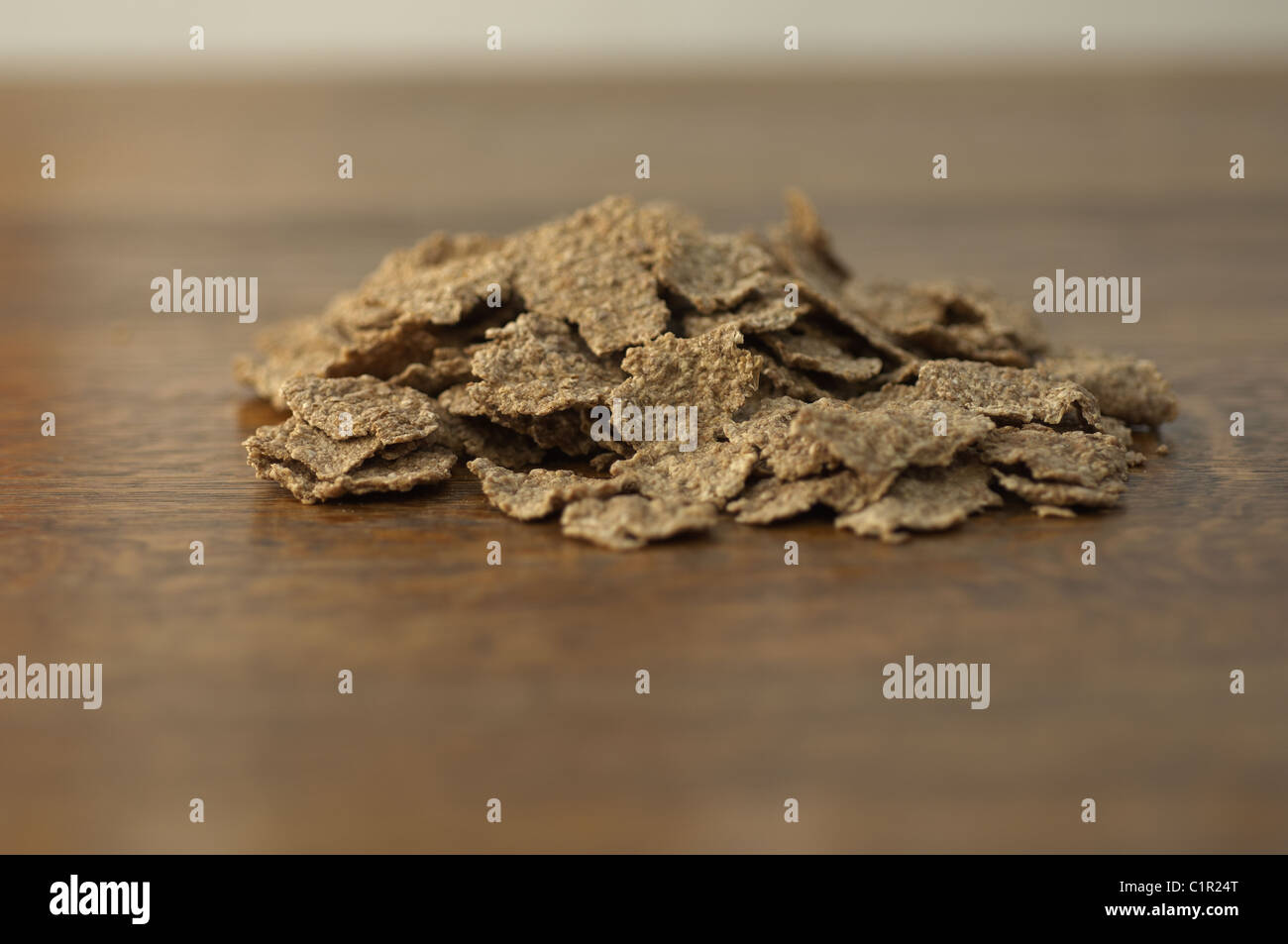 Bran flakes on an oak wood table Stock Photo - Alamy