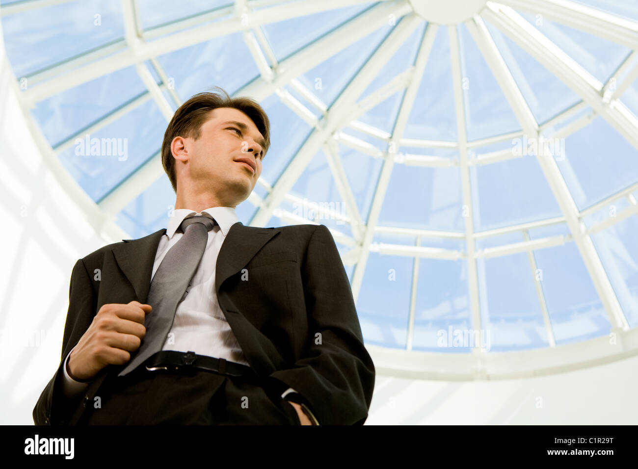 Below view of confident businessman looking aside Stock Photo - Alamy