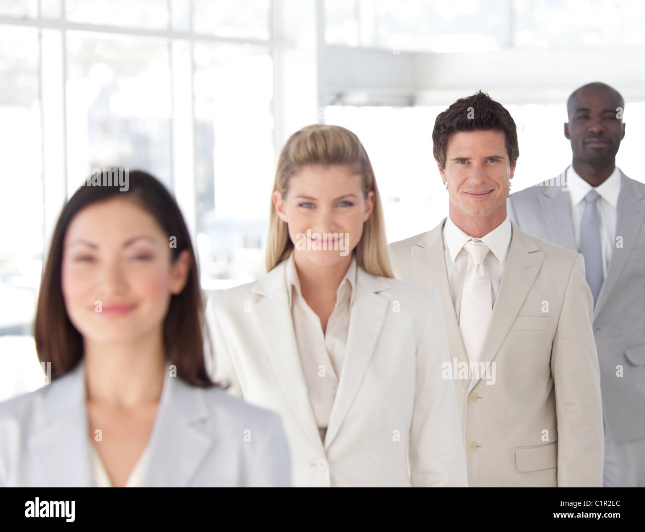 Portrait of a smiling team at work Stock Photo - Alamy