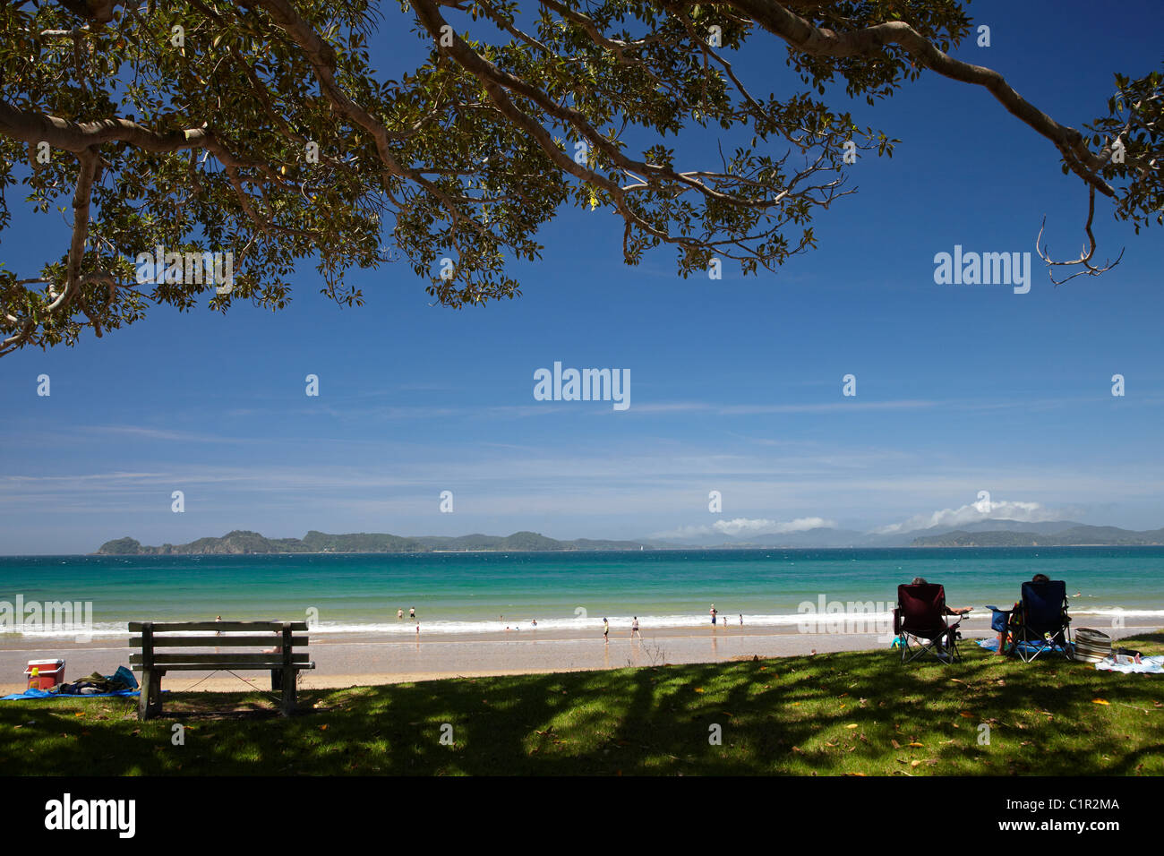 People relaxing at Long Beach, Oneroa Bay, Russell, Bay of Islands ...