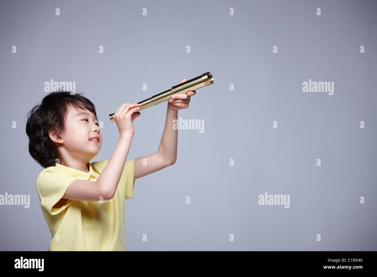 children education boy look through a telescope Stock Photo - Alamy