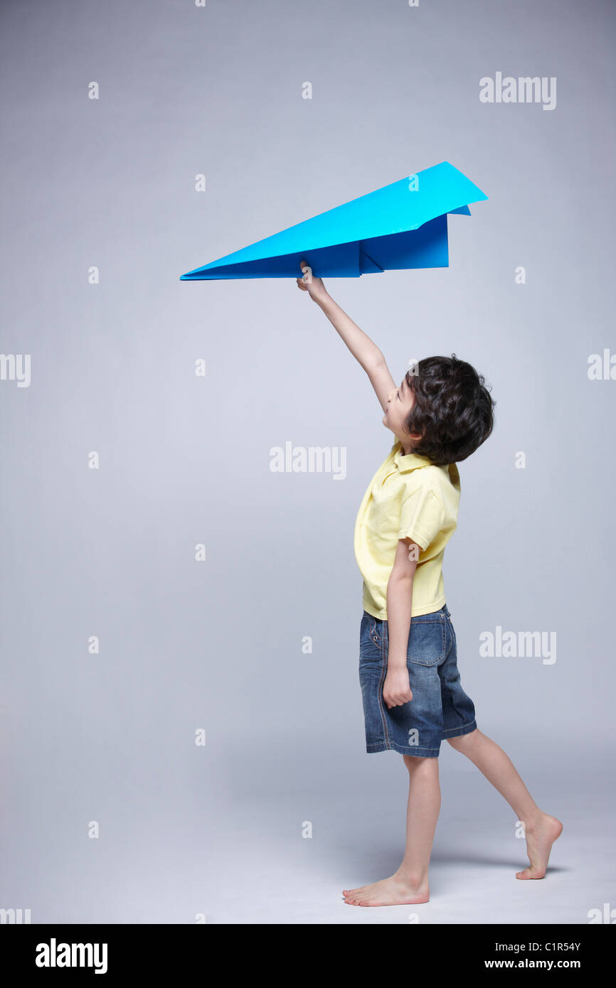 children education boy flying paper plane Stock Photo - Alamy