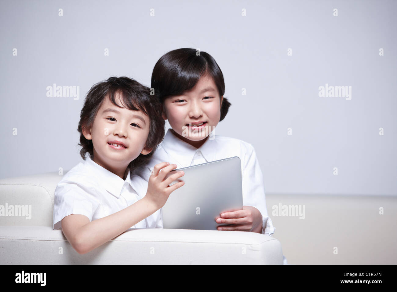 children education using tablet pc Stock Photo - Alamy