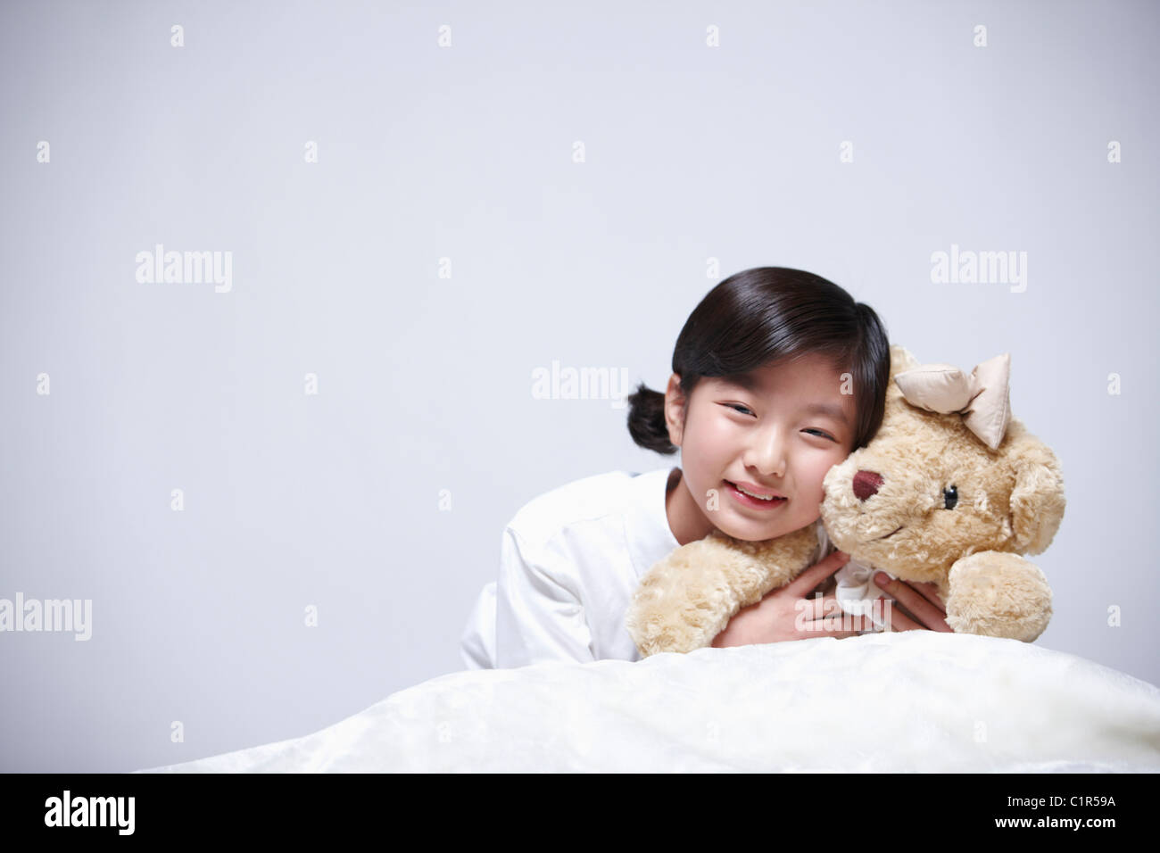 children education girl lay face down holding teddy bear Stock Photo ...