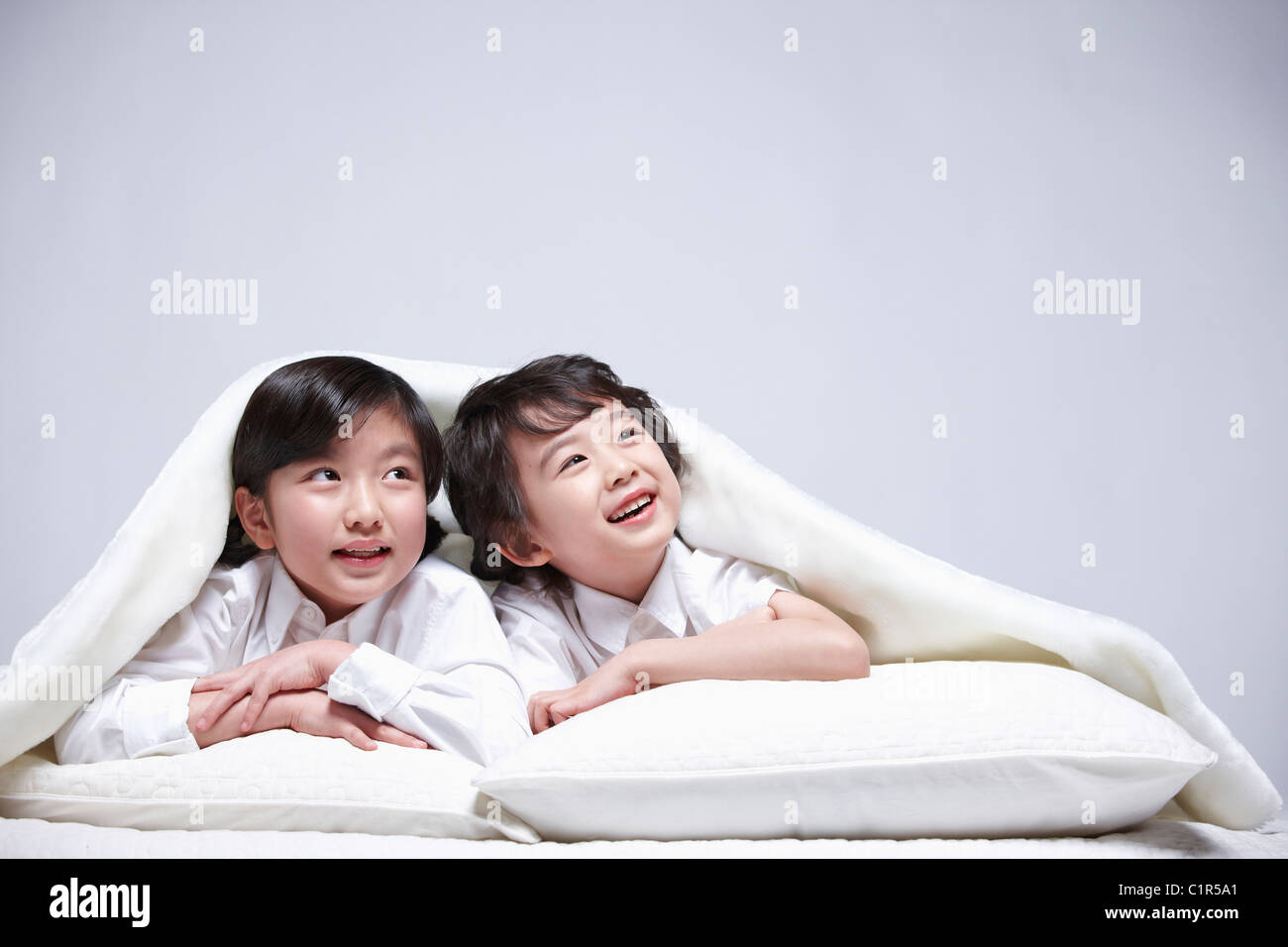 children education lay face down under the blanket Stock Photo - Alamy