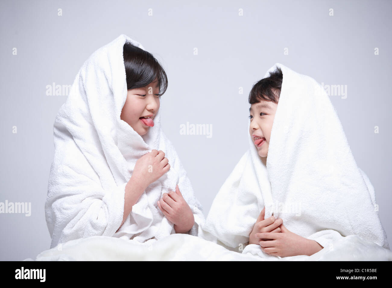 children education boy and girl covered themselves with a blanket Stock ...