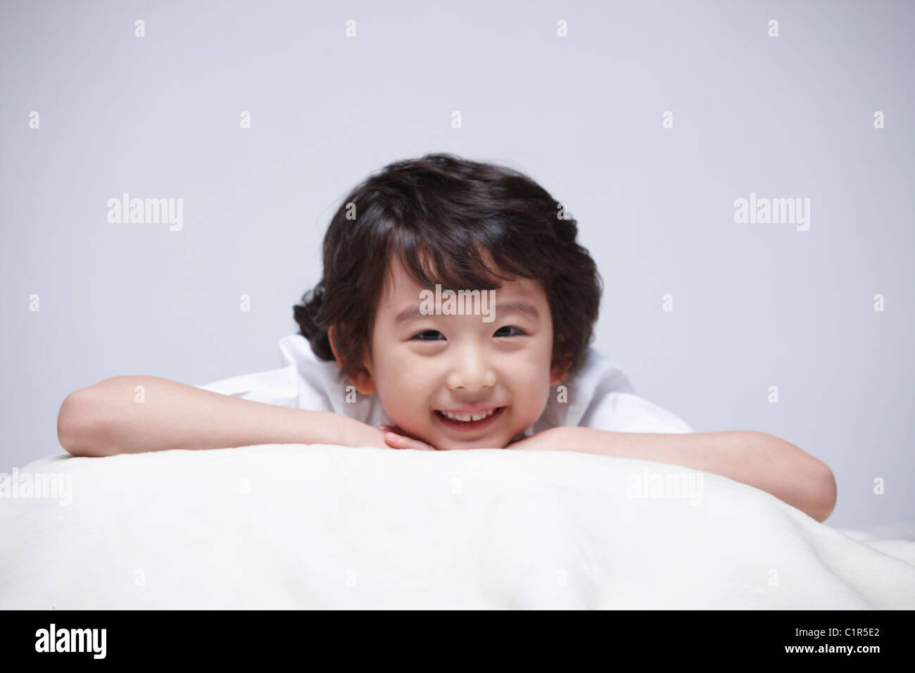 children education boy lay face down on the pillow Stock Photo - Alamy