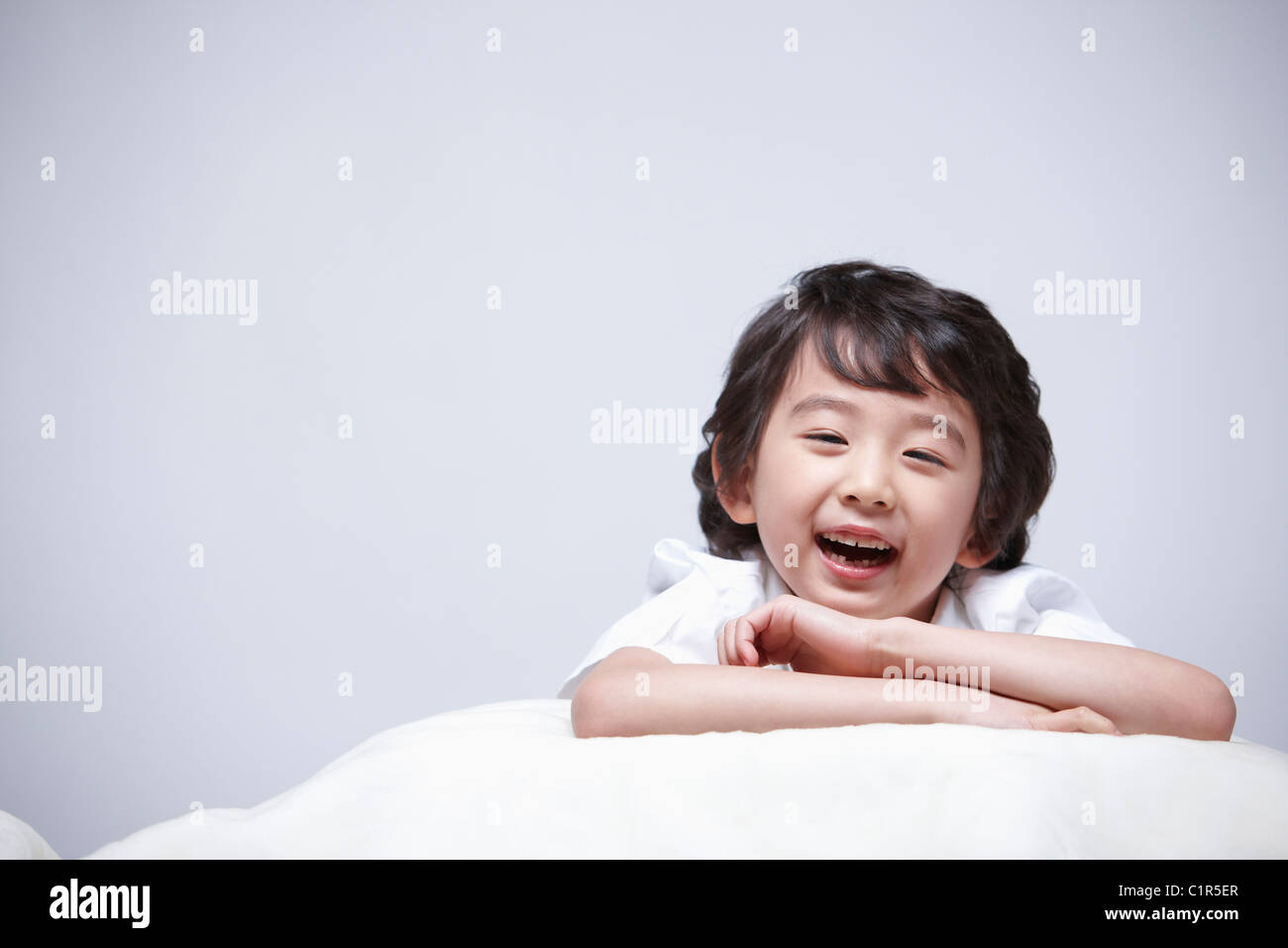 children education boy lay face down on the pillow Stock Photo - Alamy