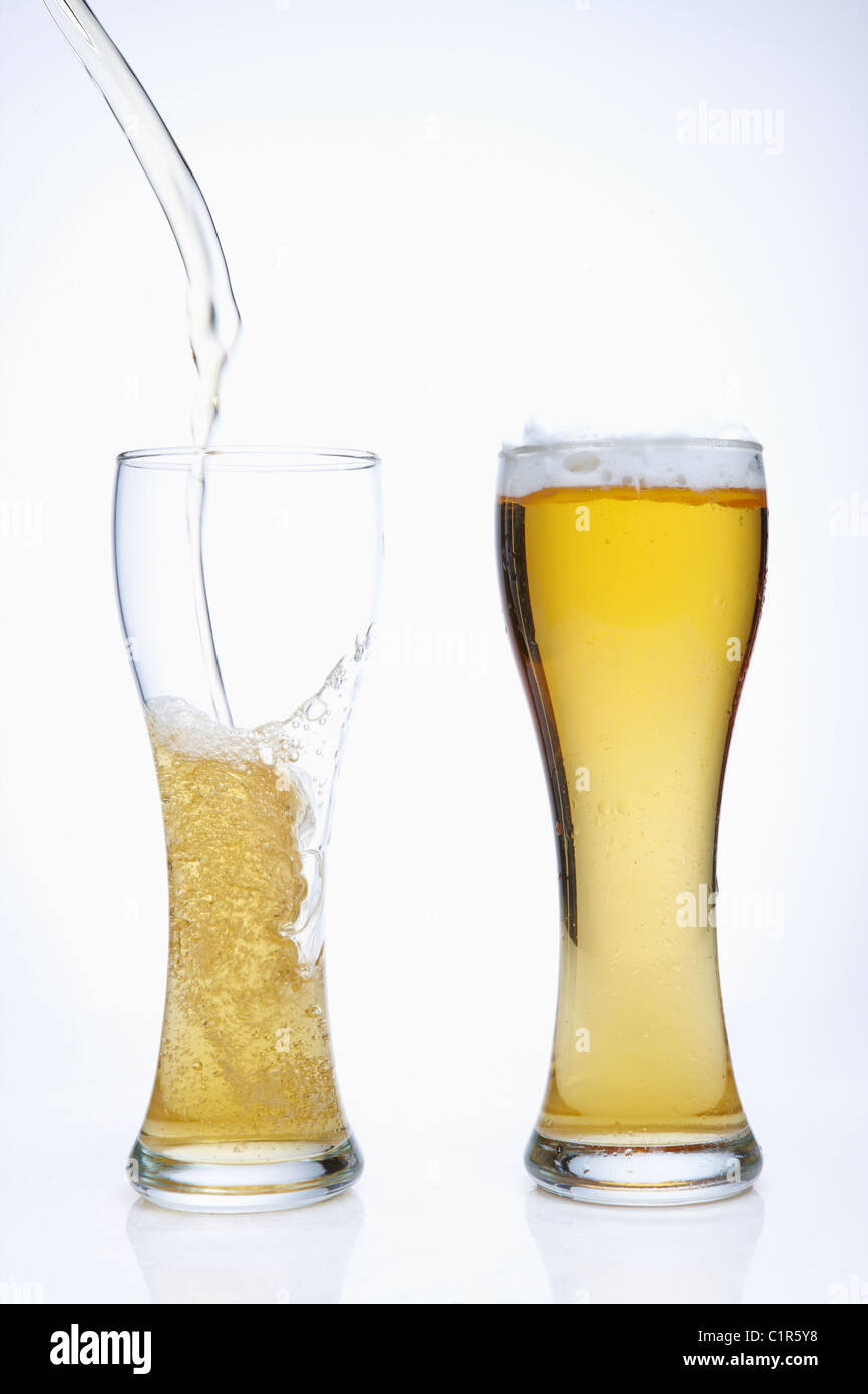 pour draft beer into glass Stock Photo - Alamy