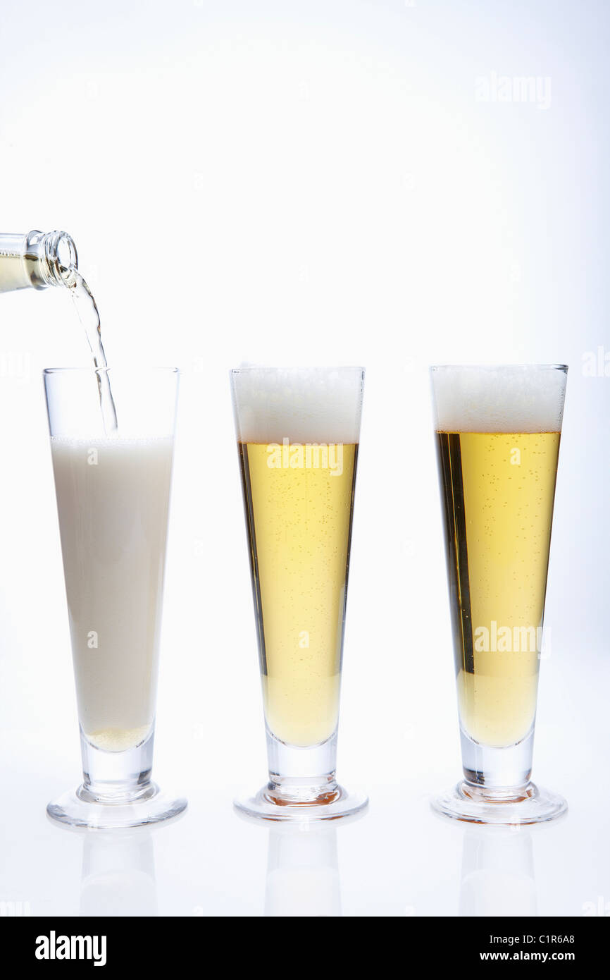 pour draft beer into glass Stock Photo - Alamy