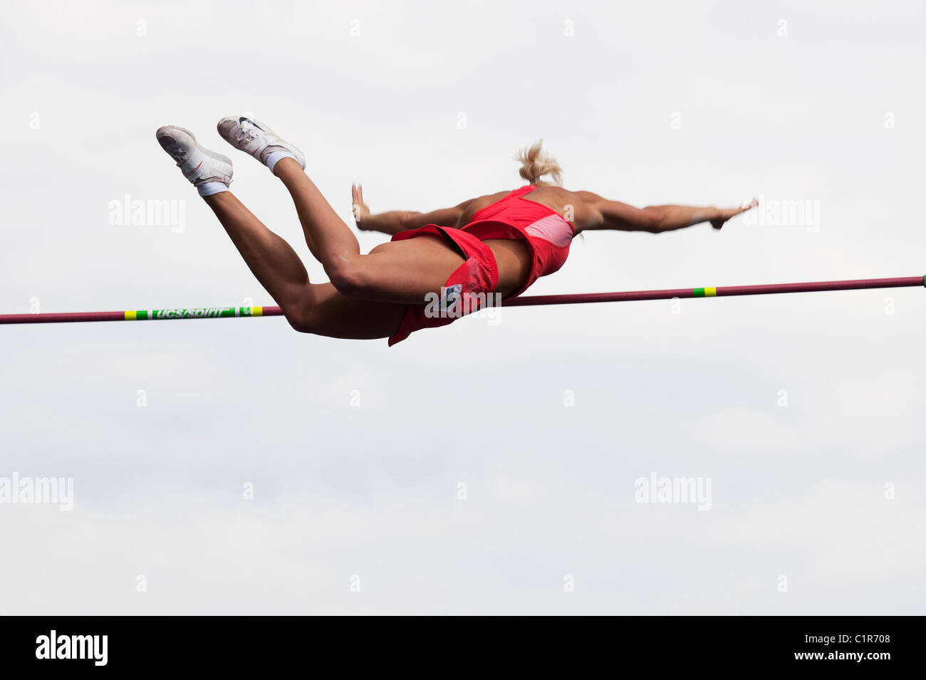Woman athlete jumping bar hi-res stock photography and images - Alamy