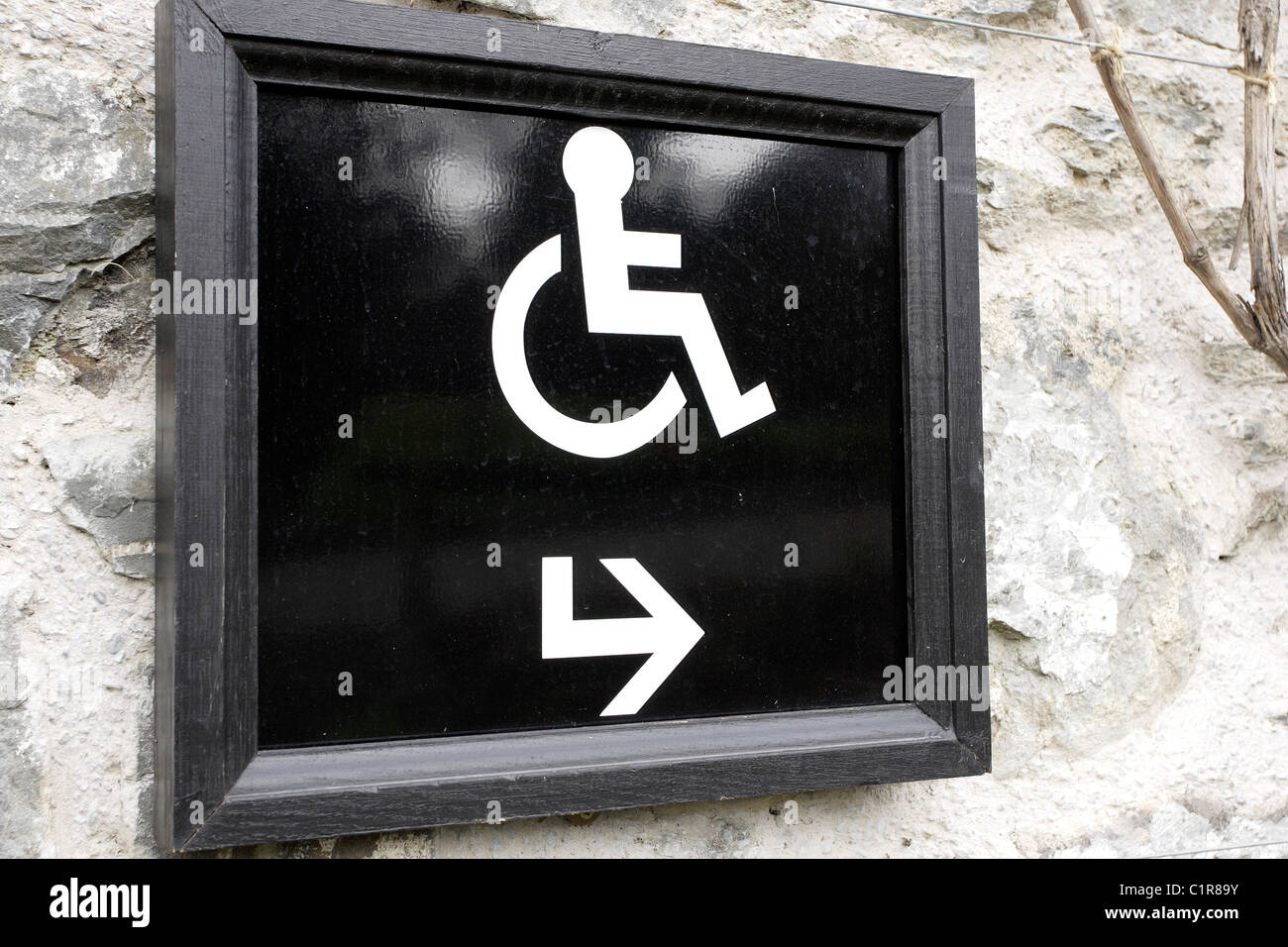Sign showing direction disabled hi-res stock photography and images - Alamy