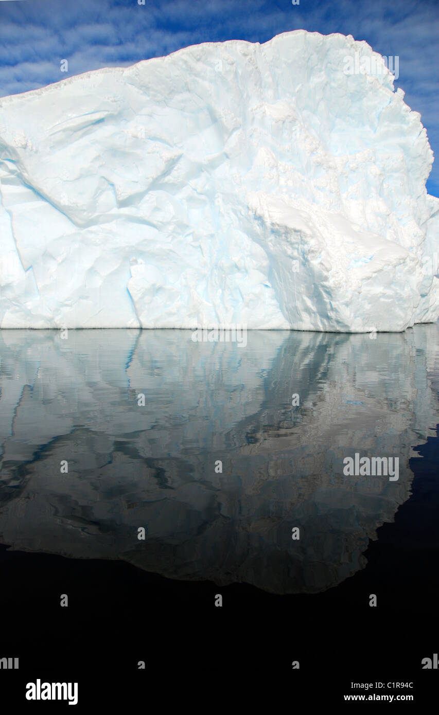 iceberg perfectly reflected in the dark ocean Stock Photo - Alamy
