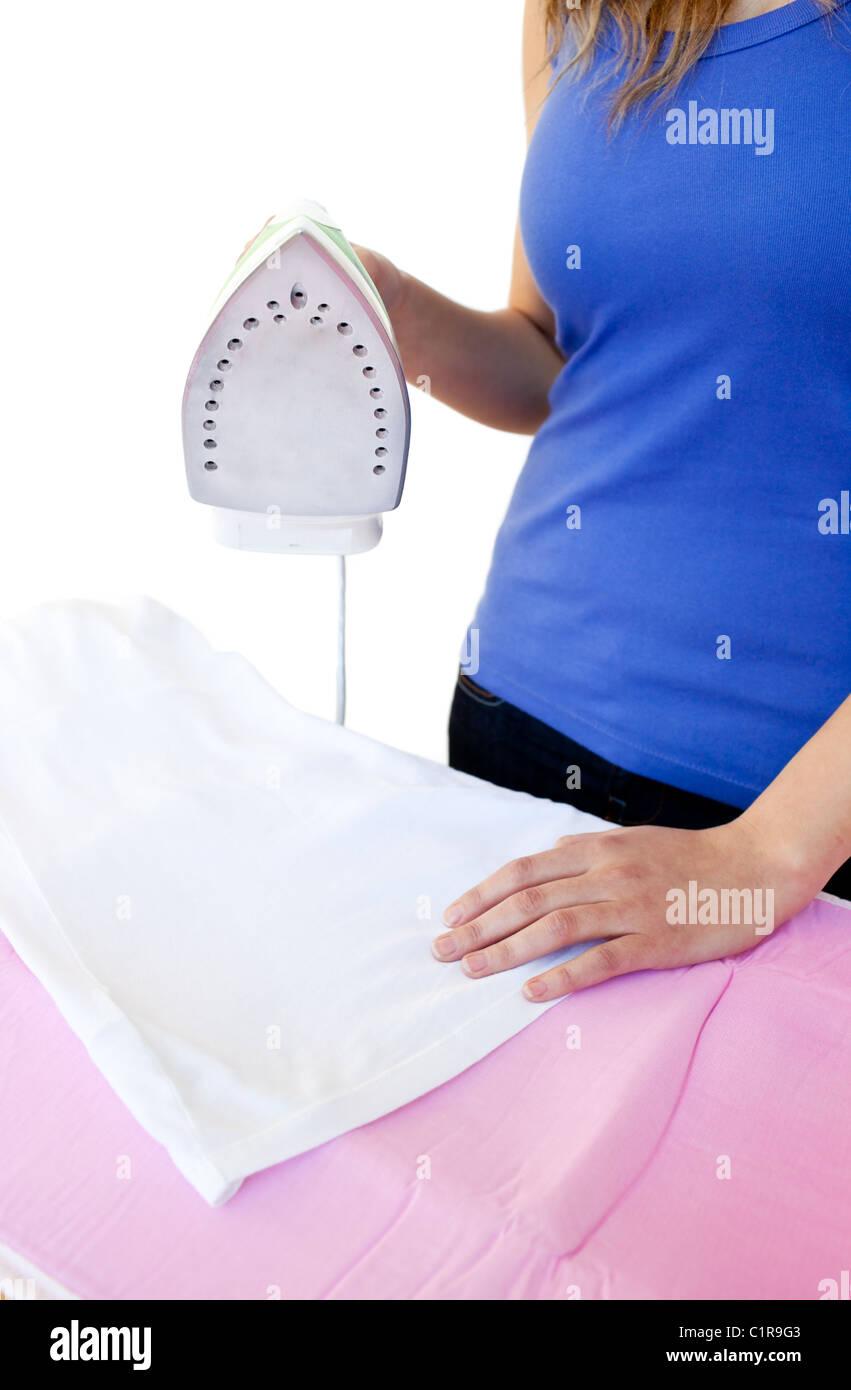 Close-up of a woman ironing against a white background Stock Photo - Alamy