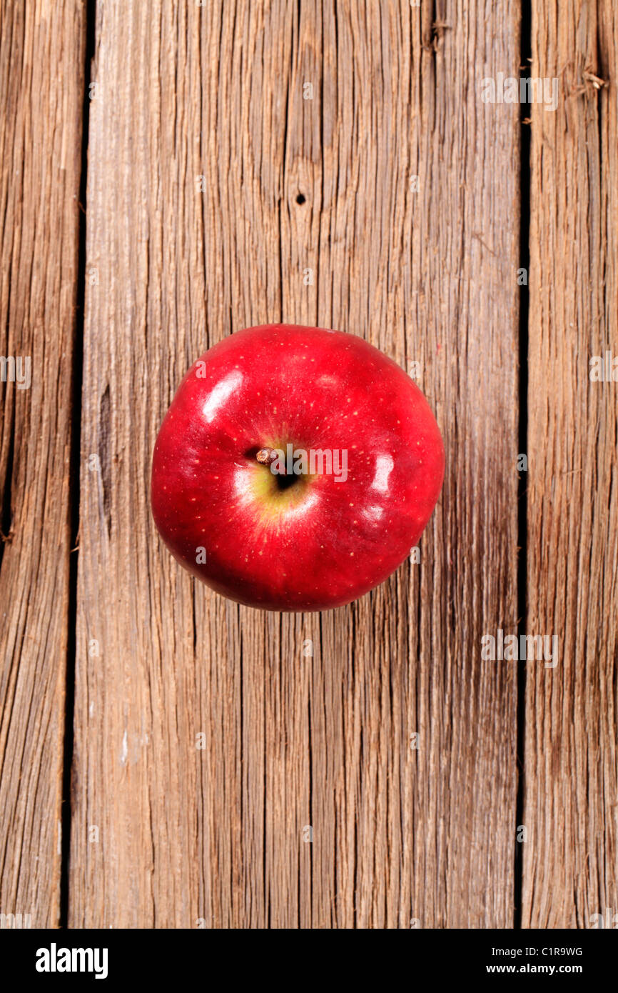 Shiny red apple on wood - overhead Stock Photo - Alamy
