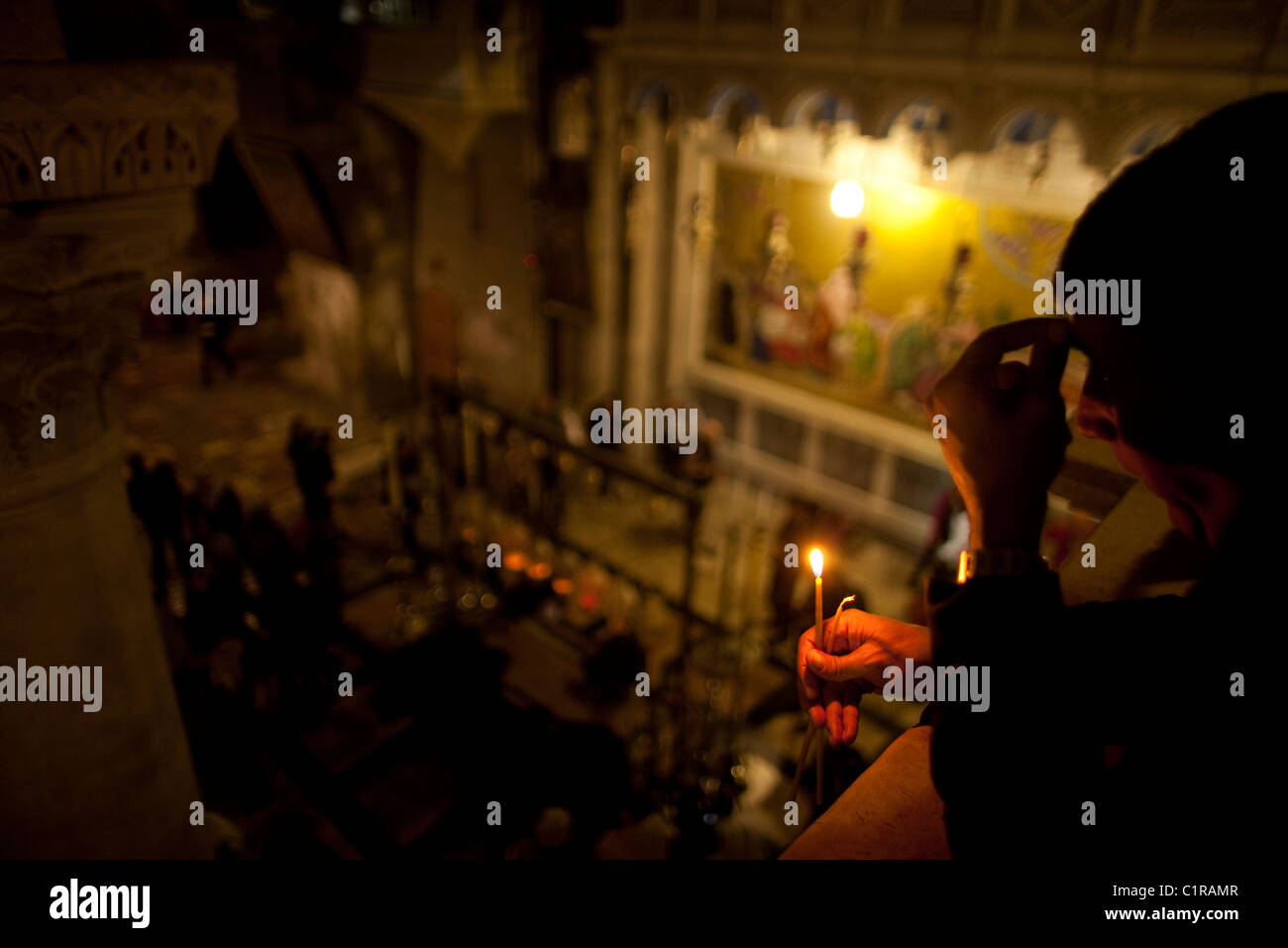 Lighting devotional candles at Calvary, Church of Holy Sepulcher ...
