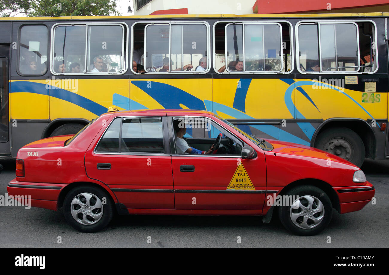 A taxi and a city bus, San Jose, Costa Rica Stock Photo - Alamy