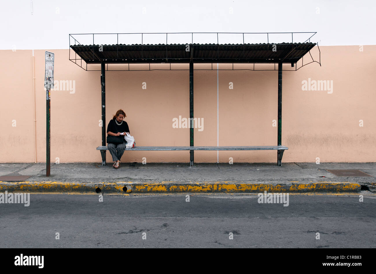 Woman at a bus stop, San Jose, Costa Rica Stock Photo - Alamy