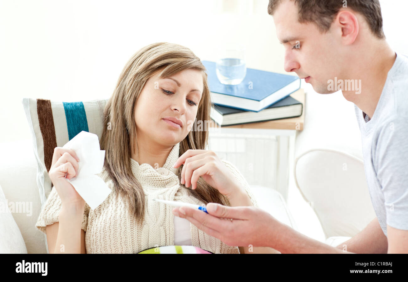 Beautiful sick woman getting pills from her boyfriend Stock Photo - Alamy