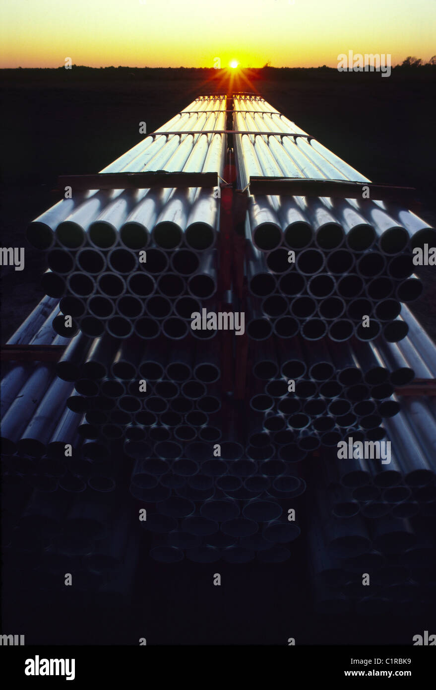 Pipe stack at sunset Stock Photo - Alamy