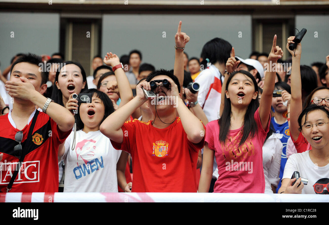 Chinese supporters of Manchester United watch the training session at ...