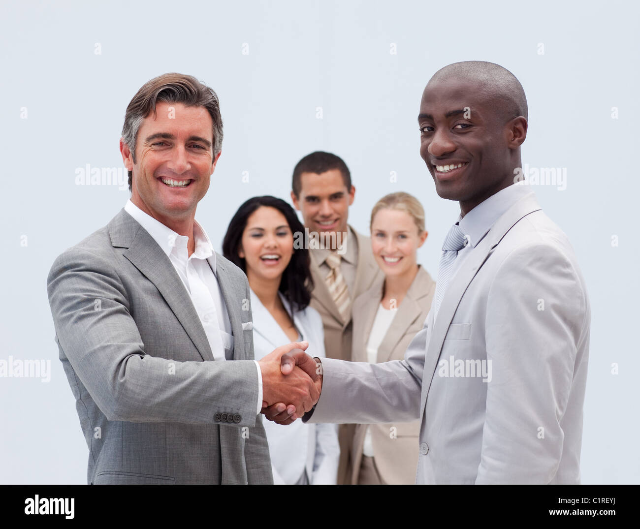 Businessmen shaking hands Stock Photo - Alamy