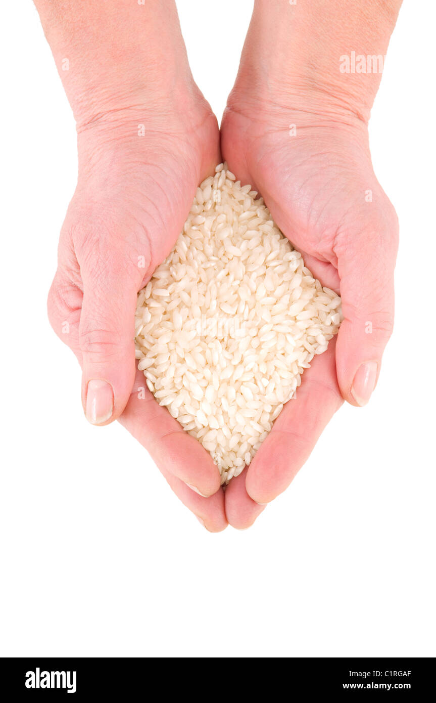 handful of rice Stock Photo - Alamy