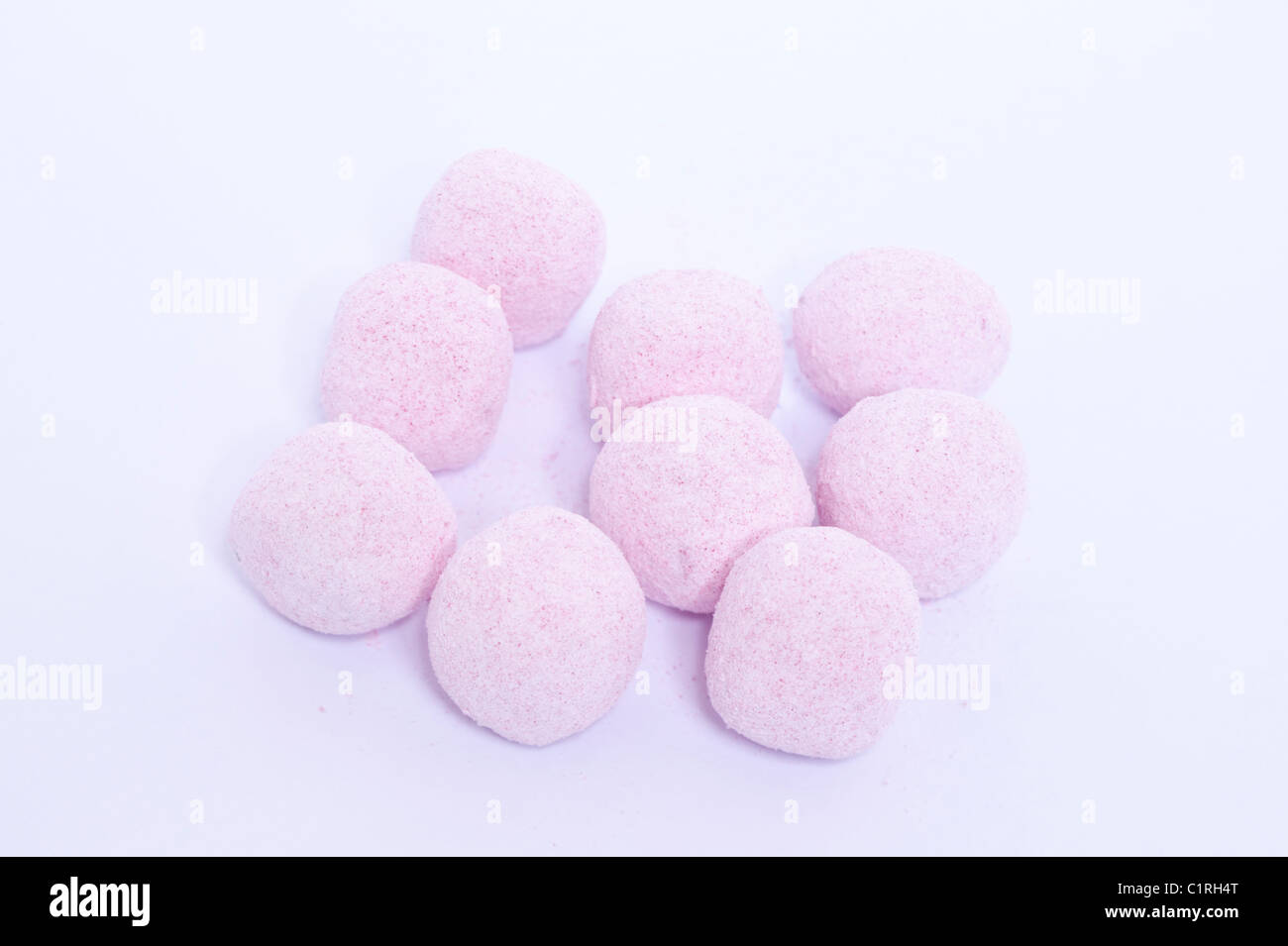 A selection of powder coated strawberry flavour bon bons traditional ...