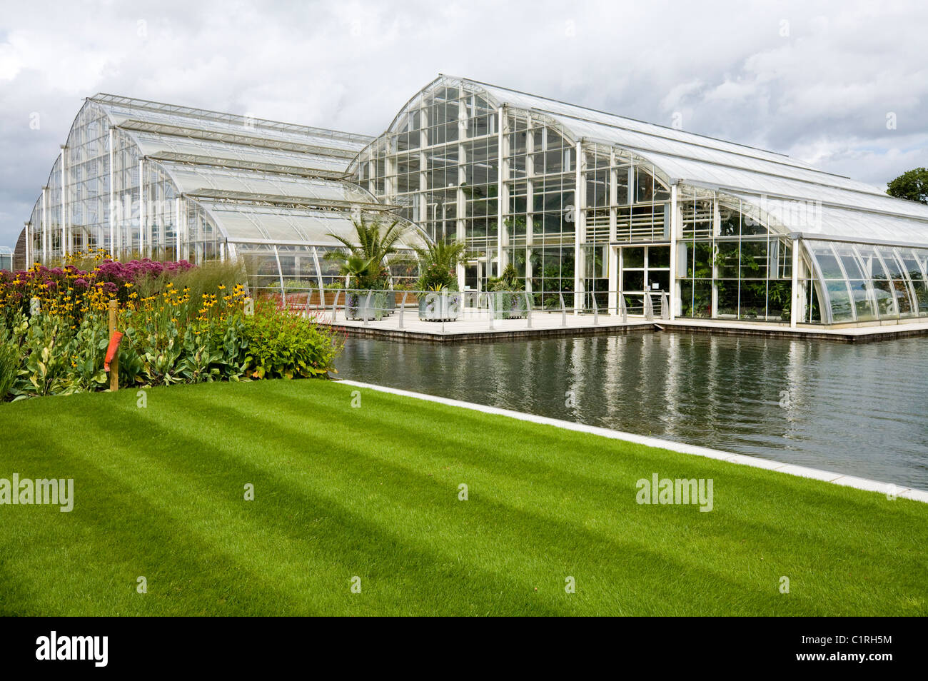 Looking over formal lawn and pond / water feature towards The ...