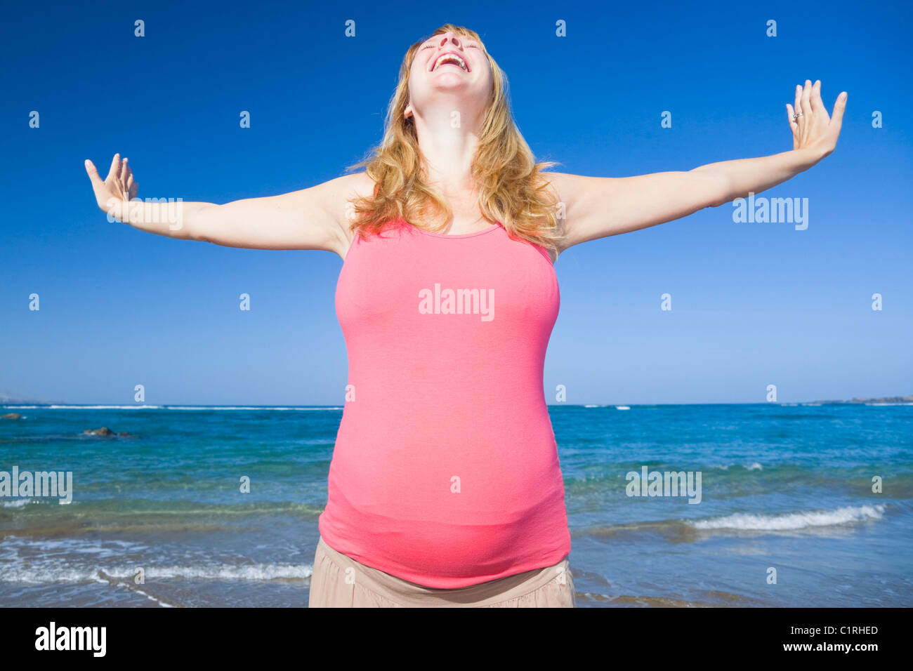 Pregnant woman by the sea Stock Photo - Alamy