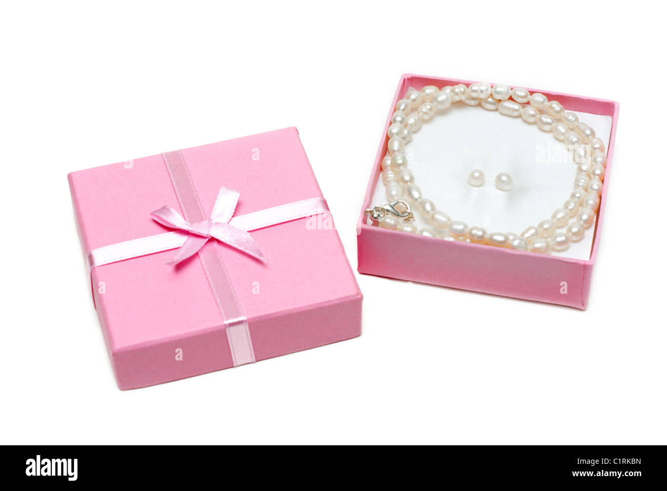 Gift box with necklace from pearl on white background Stock Photo - Alamy