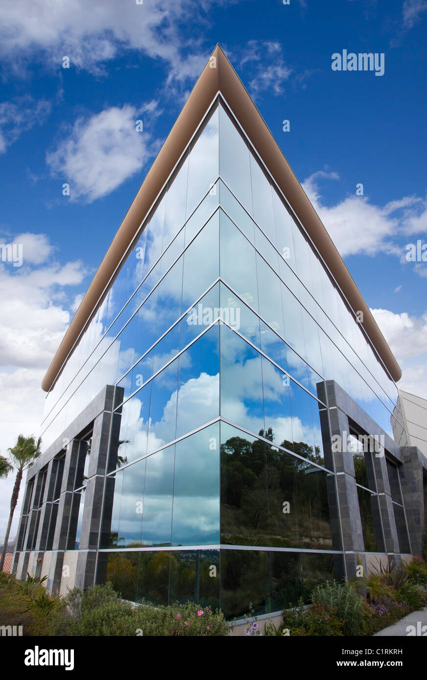 Dramatic Corporate Building with Blue Sky and Clouds Stock Photo - Alamy