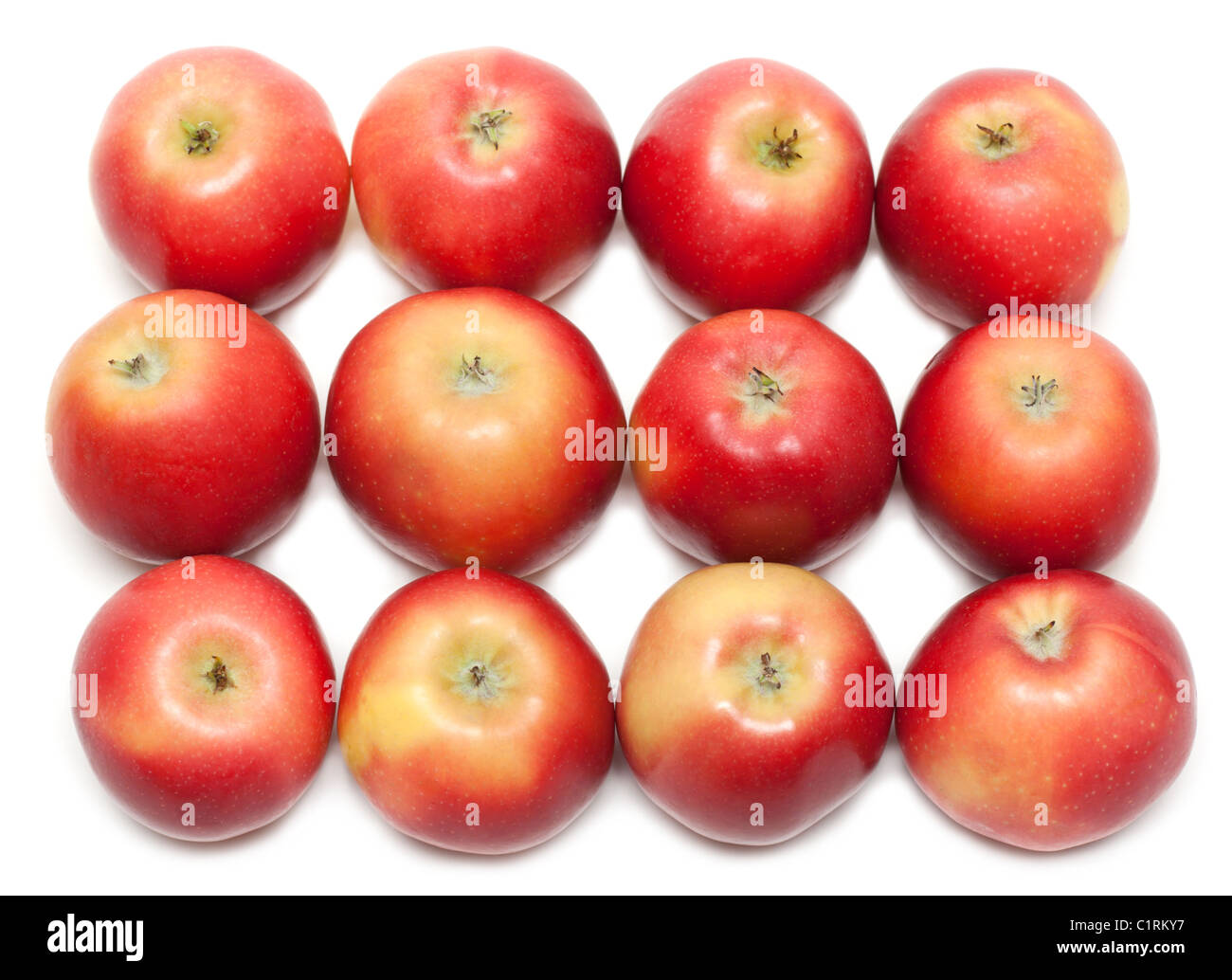 Red apple put in rows on white background Stock Photo - Alamy