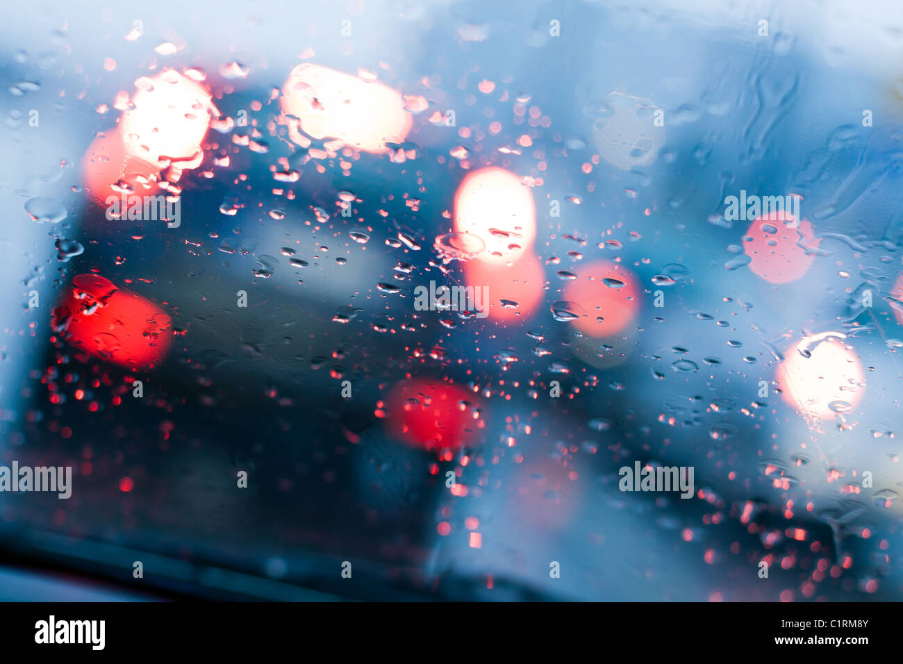 Driving car on rainy day at traffic jam Stock Photo - Alamy