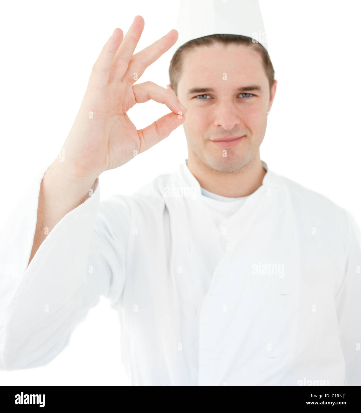 Young cook giving hand signal Stock Photo - Alamy
