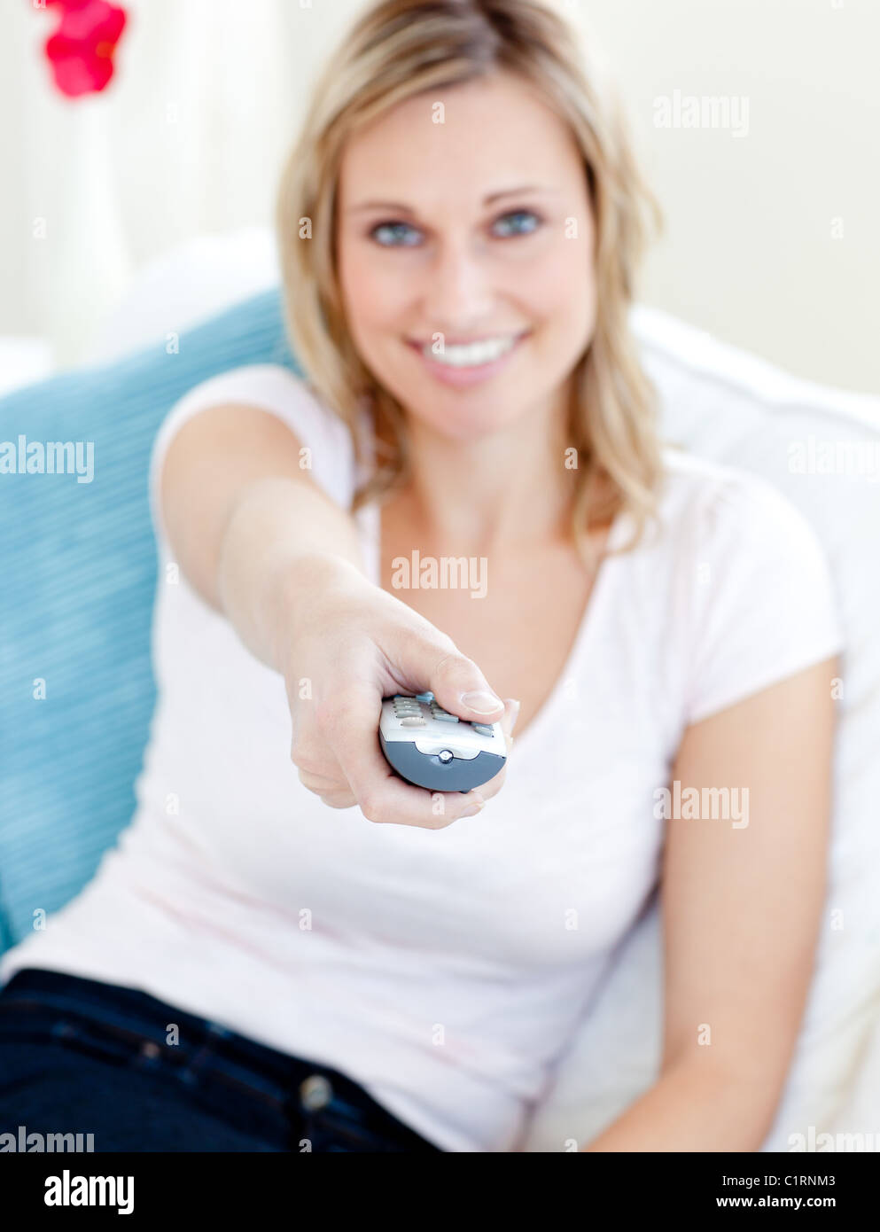 Good-looking woman watching TV Stock Photo - Alamy