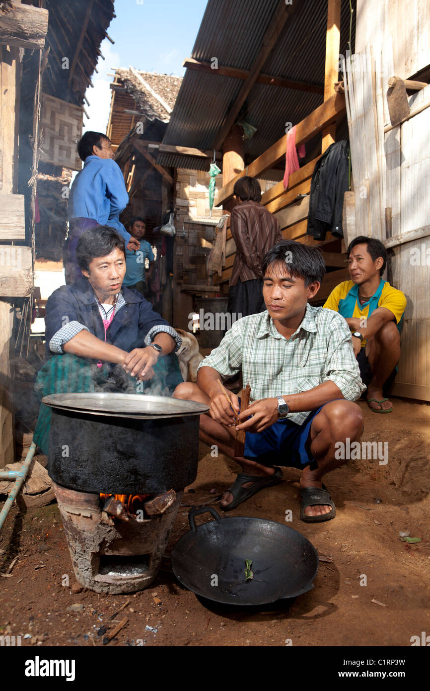 Karen Long neck hill tribes man cooking for pray Good luck the home ...