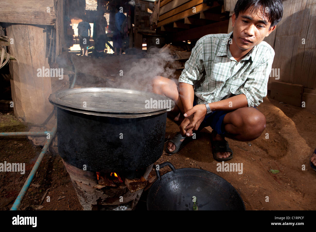 Karen Long neck hill tribes man cooking for pray Good luck the home ...